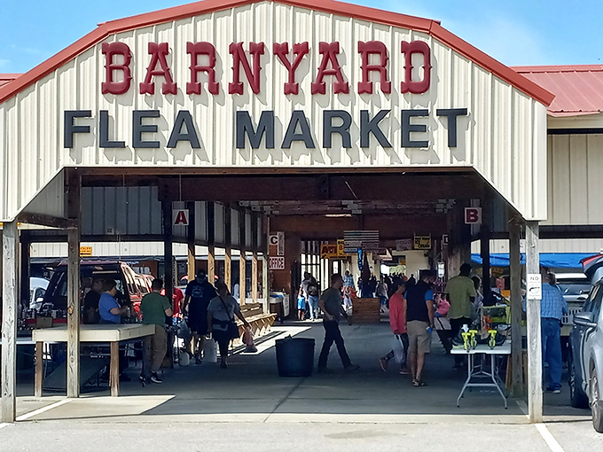 The iconic red-lettered entrance to Barnyard Flea Market beckons treasure hunters with promises of undiscovered gems and weekend adventures waiting just inside.