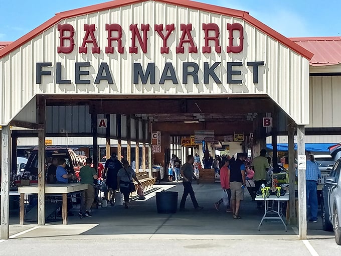 The iconic red-lettered entrance to Barnyard Flea Market beckons treasure hunters with promises of undiscovered gems and weekend adventures waiting just inside.