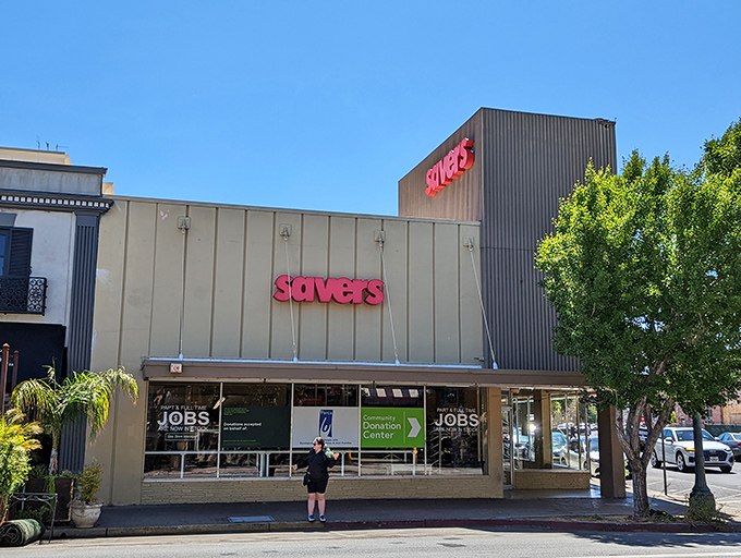 The unassuming exterior of Savers belies the wonderland of secondhand treasures waiting inside. Like a beige fortress guarding vintage gold.
