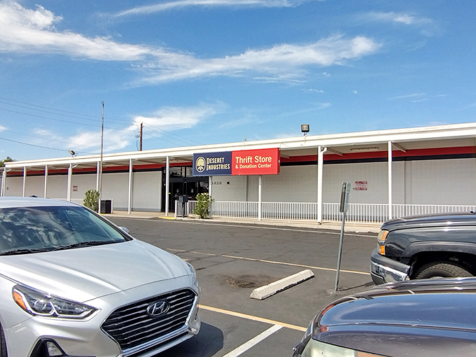 The unassuming exterior hides a bargain hunter's paradise. Those colorful pennant flags are basically saying "Treasures ahead!" in thrift-speak.