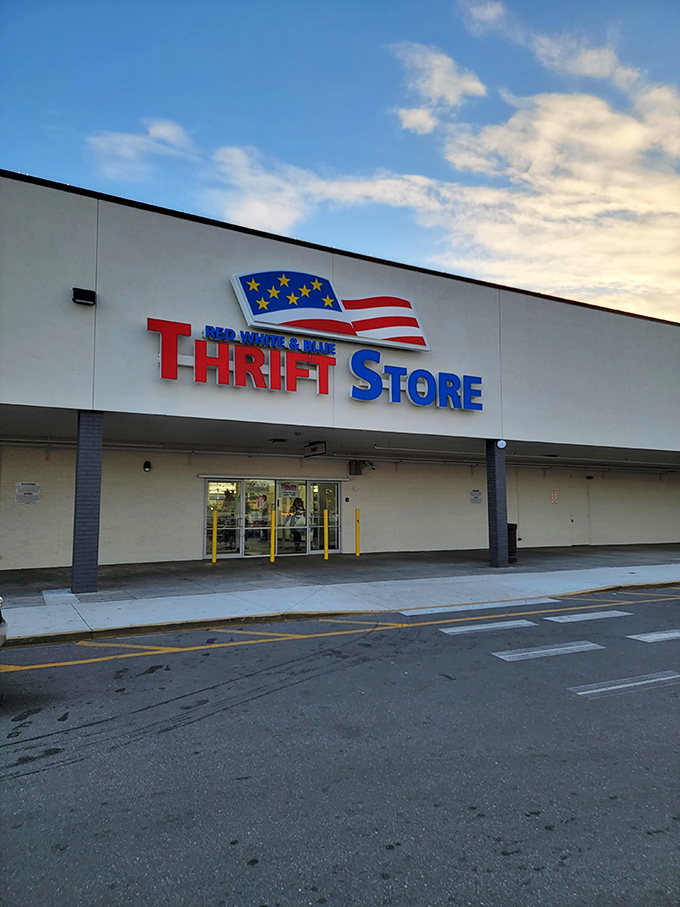 The patriotic facade of Red White and Blue Thrift Store stands proudly against the Tampa sky, a beacon for bargain hunters with its unmistakable red, white, and blue signage.