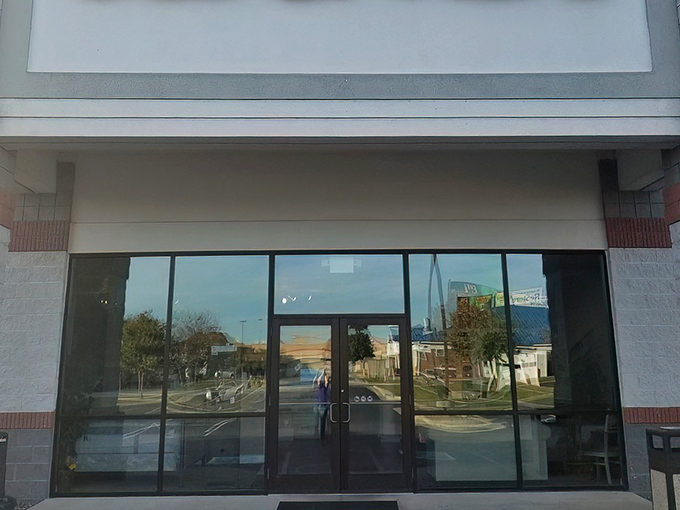 The unassuming storefront of Sell It Here belies the wonderland of treasures waiting inside. Like a portal to the past, these doors invite exploration.