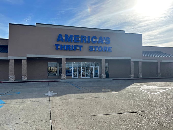The iconic blue signage of America's Thrift Store beckons bargain hunters like a retail lighthouse guiding ships to treasure-filled shores.