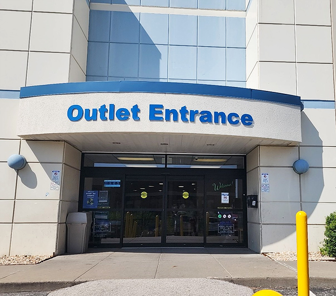 The yellow facade of Kansas City's Goodwill Outlet gleams like a beacon for bargain hunters under the clear Missouri sky.