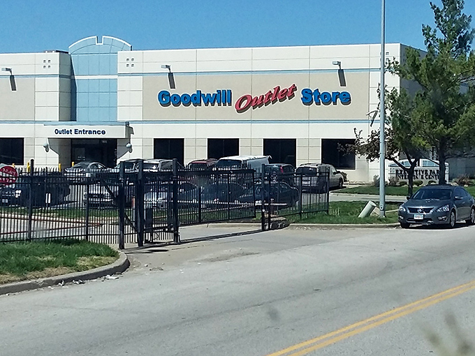 The yellow facade of Kansas City's Goodwill Outlet gleams like a beacon for bargain hunters under the clear Missouri sky.