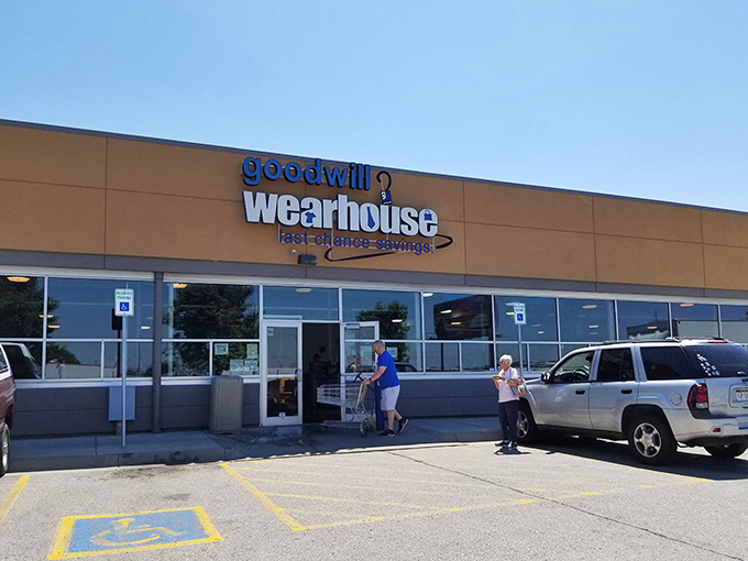 The unassuming beige exterior of the Goodwill Outlet belies the treasure-hunting paradise within—like finding a secret portal to bargain heaven in suburban Omaha.