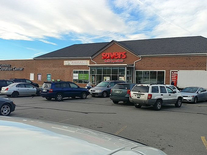 The Savers storefront at dusk, where budget dreams take flight alongside that airplane in the background. Treasure hunting season is always open here.