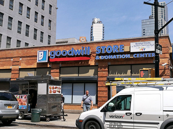 The brick facade of Brooklyn's Goodwill welcomes bargain hunters like a treasure chest waiting to be opened, promising affordable finds behind its glass doors.