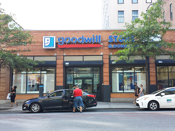 The brick facade of Brooklyn's Goodwill welcomes bargain hunters like a treasure chest waiting to be opened, promising affordable finds behind its glass doors.