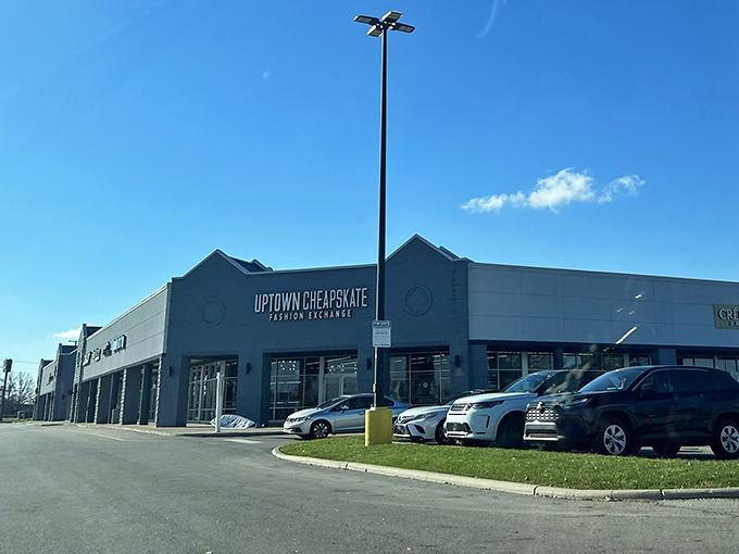 The sleek blue-gray exterior of Uptown Cheapskate stands like a fashion oasis in Hilliard, promising treasure hunters a bounty of brand-name bargains inside.