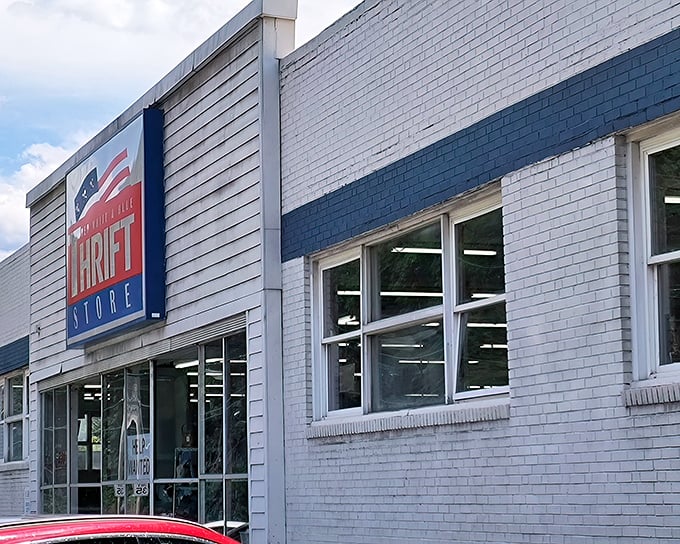 The patriotic facade of Red White And Blue Thrift Store beckons bargain hunters like a siren song for the fiscally responsible.