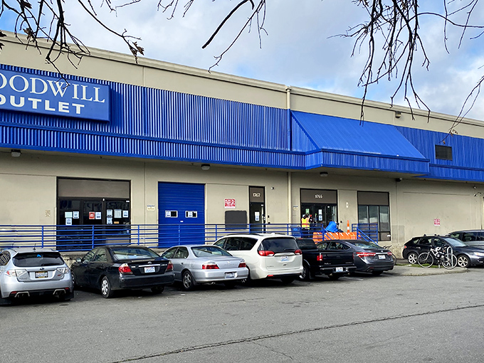 The blue-trimmed exterior of Seattle Outlet Goodwill stands like a portal to bargain dimension&mdash;where treasures await those brave enough to enter. 