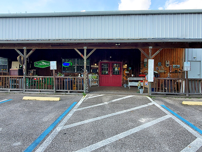 The unassuming exterior of Antique City Mall beckons with its rustic charm and iconic red door &ndash; Florida's time machine disguised as a country store.