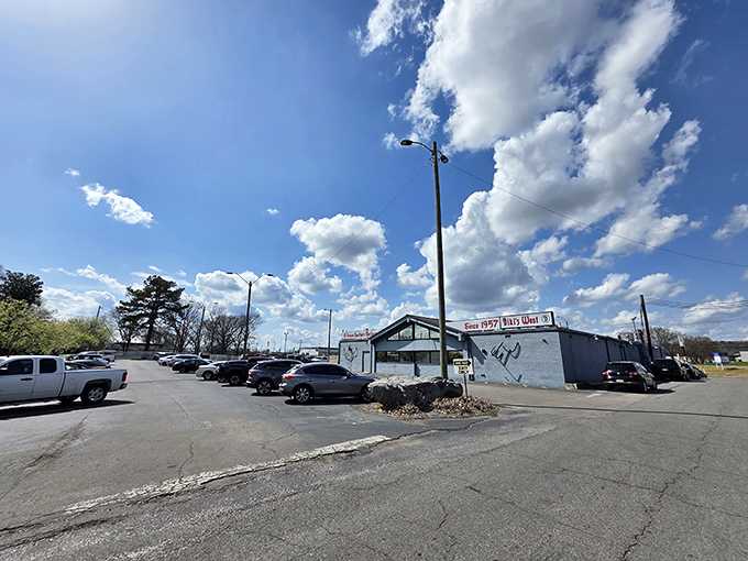 The unassuming exterior of Niki's West stands like a culinary lighthouse on Finley Avenue, beckoning hungry Alabamians with its "Unique Southern Restaurant" promise since 1957.