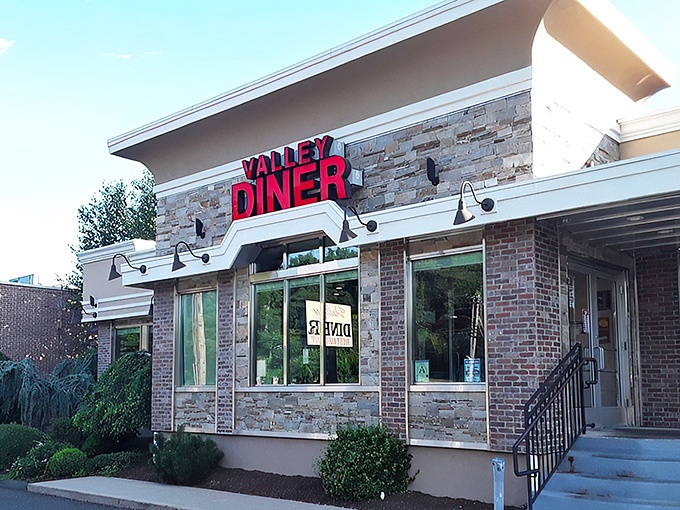 Valley Diner stands proudly on New Haven Avenue in Derby, its classic exterior promising comfort food treasures within. No fancy gimmicks, just honest-to-goodness diner goodness.