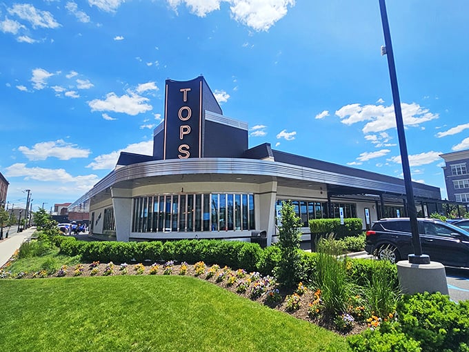 The iconic blue and silver fa&ccedil;ade of Tops Diner stands proudly against the New Jersey sky, like a beacon calling hungry travelers home.