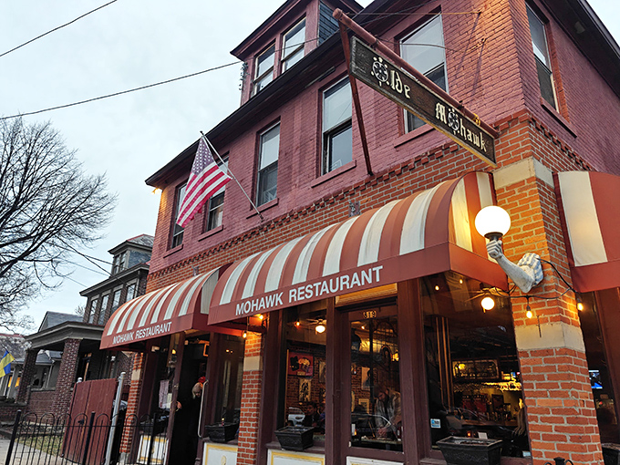 That iconic striped awning isn't just a canopy&mdash;it's a beacon for hungry souls wandering German Village after dark. Comfort food salvation awaits.