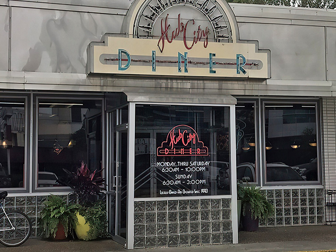 The neon-kissed facade of Hub City Diner beckons like a lighthouse for the hungry, promising retro charm and comfort food salvation.