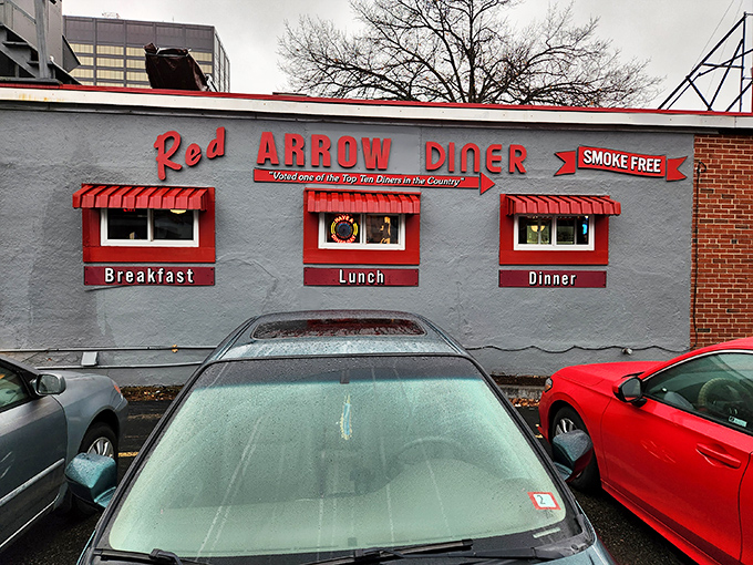 The iconic neon sign beckons hungry travelers like a lighthouse for the famished. This brick-and-mortar time machine has been Manchester's comfort food headquarters for generations.