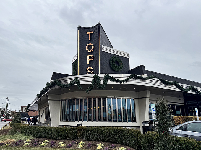 The iconic blue and silver fa&ccedil;ade of Tops Diner stands proudly against the New Jersey sky, like a beacon calling hungry travelers home.