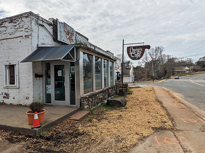 The neon glow of Lupie's sign beckons like a lighthouse for the hungry soul. This unassuming exterior hides Charlotte's comfort food paradise.