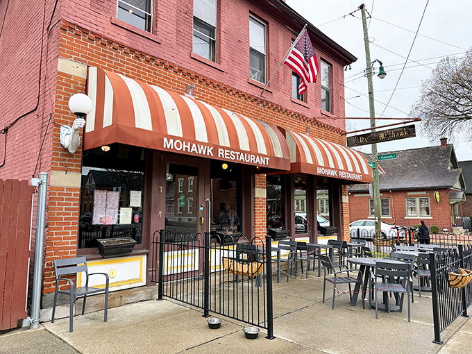 That iconic striped awning isn't just a canopy&mdash;it's a beacon for hungry souls wandering German Village after dark. Comfort food salvation awaits.