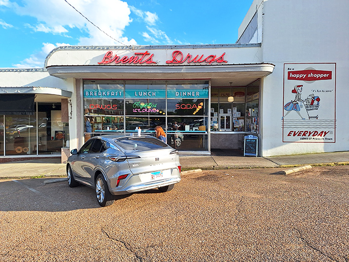 The neon promise of "Breakfast, Lunch, Dinner" glows beneath that iconic retro signage, like a time machine disguised as a storefront in Jackson's Fondren neighborhood.