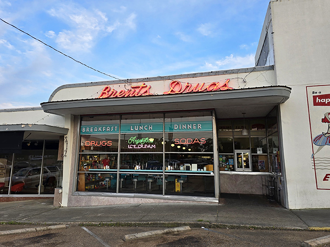 The neon promise of "Breakfast, Lunch, Dinner" glows beneath that iconic retro signage, like a time machine disguised as a storefront in Jackson's Fondren neighborhood.