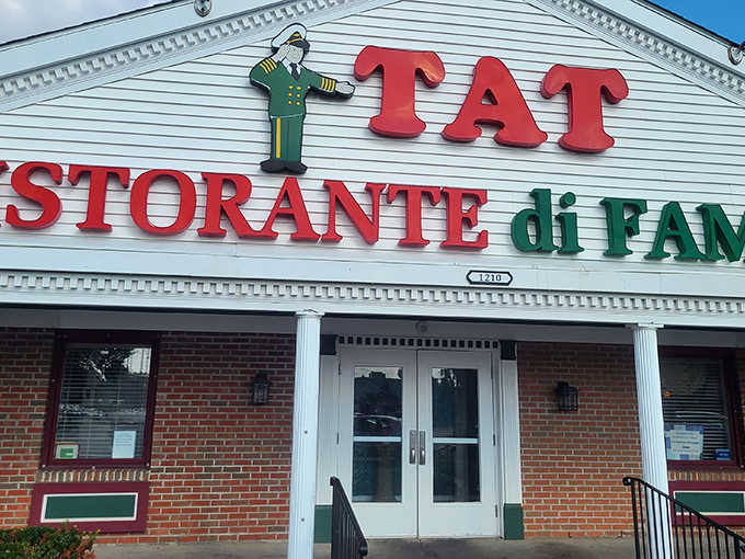 The iconic white building with its distinctive cupola and bold red lettering stands as a Columbus landmark. TAT's exterior promises Italian-American comfort before you even step inside.