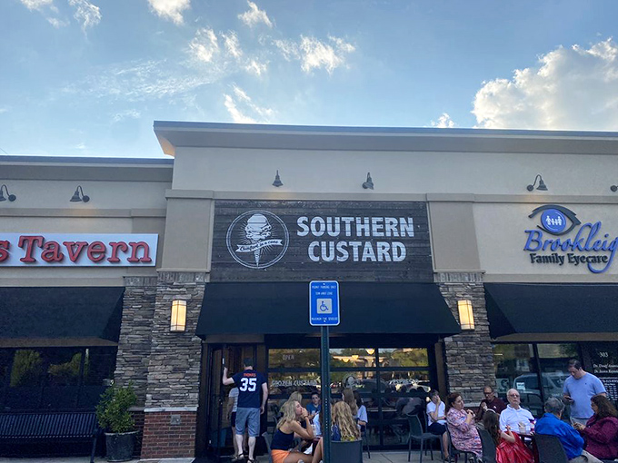 Southern Custard's storefront beckons with its sleek black awning and stone accents. The crowd outside tells you everything you need to know&mdash;this place is worth the wait.