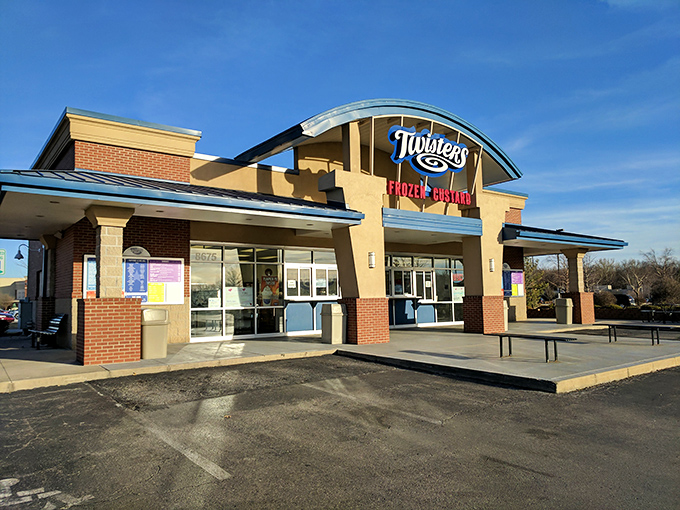 Twisters stands like a beacon of dairy delight with its distinctive curved blue roof, practically whispering sweet promises to passersby.