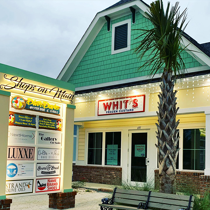 The mint-green beach cottage with its cheerful "WHIT'S FROZEN CUSTARD" sign promises sweet relief from the Carolina heat. Vacation mode: activated.