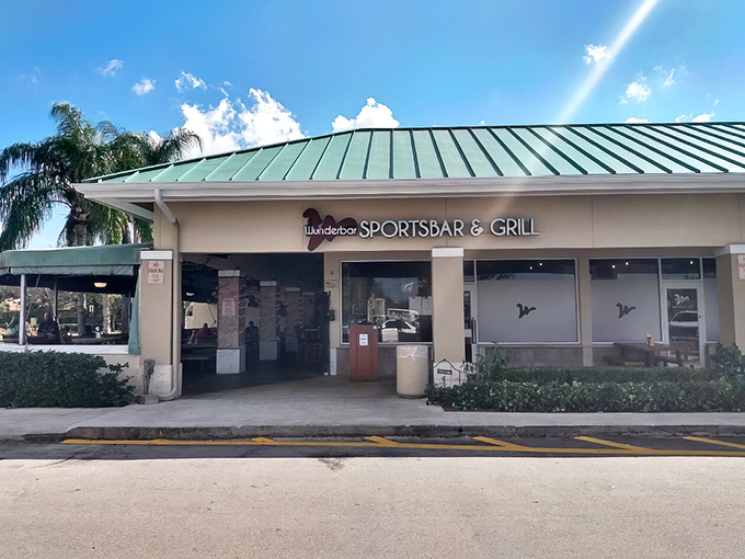 The green-roofed oasis of Wunderbar beckons with its vibrant red signage and lush entrance &ndash; a little slice of Bavaria hiding in plain sight.