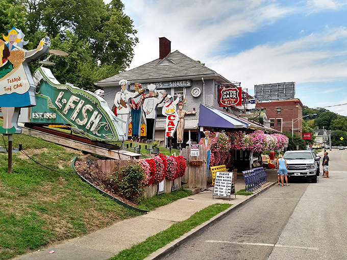 The Turf Club's exterior is a delightful contradiction &ndash; part roadside attraction, part culinary institution, with vintage figurines standing guard over burger paradise.