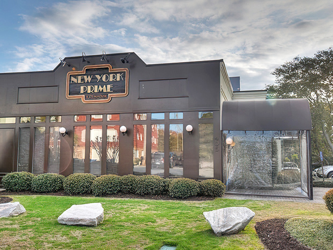 The neon glow of New York Prime beckons like a lighthouse for steak lovers&mdash;a humble exterior that belies the culinary treasures waiting inside.