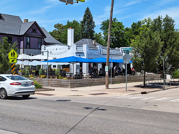 Twilight transforms this former service station into a magical oasis, where string lights and happy diners create the perfect Michigan summer evening vibe.