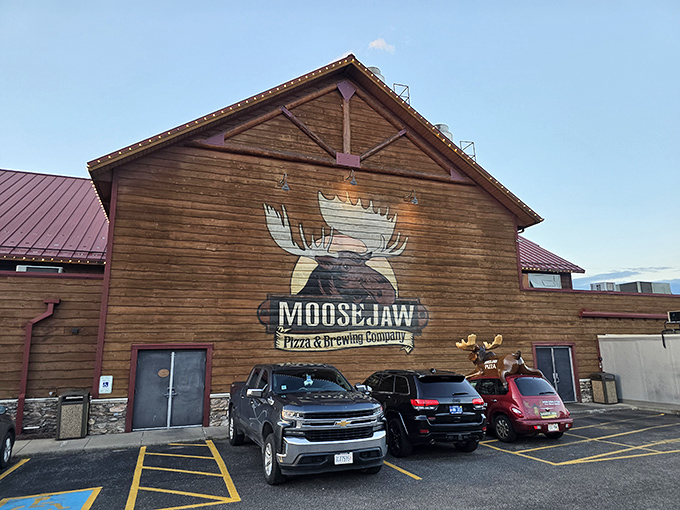 The log cabin palace of pizza rises from the Wisconsin landscape like Paul Bunyan's dream retirement home, complete with a watchful moose guardian.