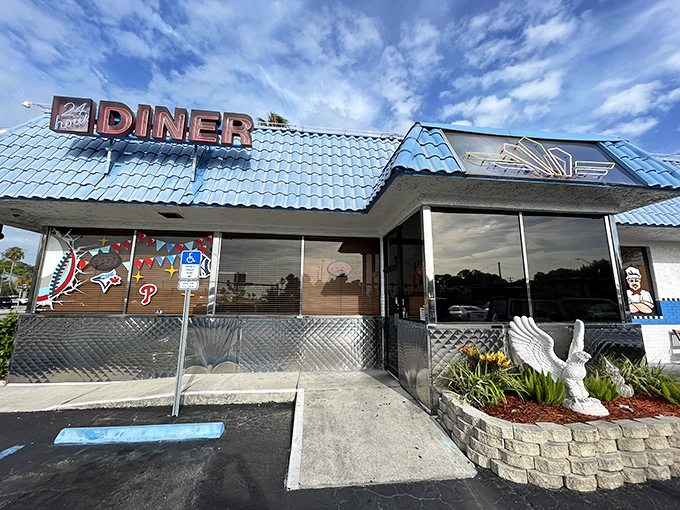 The iconic blue-roofed exterior of Papa's stands like a beacon for breakfast lovers, promising comfort food salvation under the Florida sun.