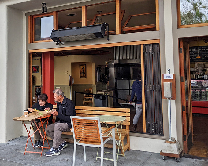 The humble storefront where pizza dreams come true. Simple outdoor seating invites you to dive right in without pretense or delay.