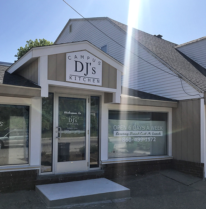 The iconic teal awning of DJ's Campus Kitchen beckons breakfast lovers like a lighthouse for the hungry souls of New London.
