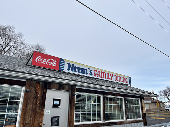 The unassuming exterior of Norm's Family Dining stands like a beacon of breakfast hope in Twin Falls, where pancake pilgrimages begin beneath that iconic red Coca-Cola sign.