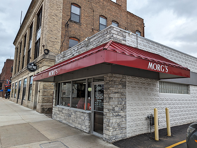 Morg's iconic white building with its bold red script sign stands as a beacon of breakfast hope on Mulberry Street in Waterloo.