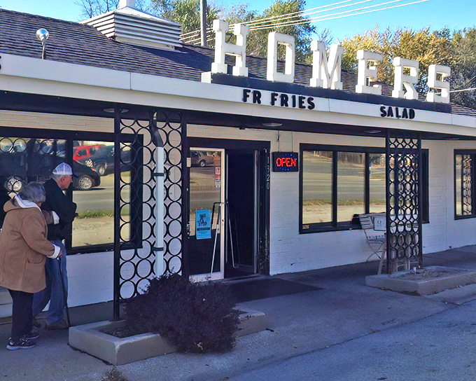 The classic diner beckons with its vintage signage proudly announcing "BEEF HAMBURGERS" – like a time portal to simpler, deliciously unpretentious days.
