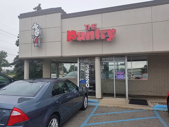The unassuming exterior of The Pantry Restaurant, where breakfast dreams come true and parking spots are worth their weight in maple syrup.