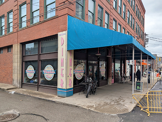 The blue awning and line of hungry patrons tell you everything: this isn't just breakfast, it's a Pittsburgh pilgrimage worth every minute of the wait.