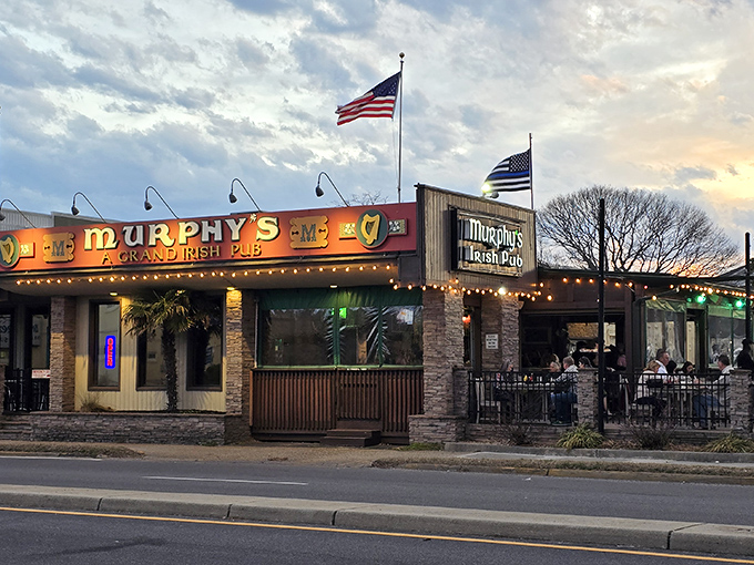 Murphy's Irish Pub beckons with stone facade charm and twinkling lights that promise authentic craic inside.