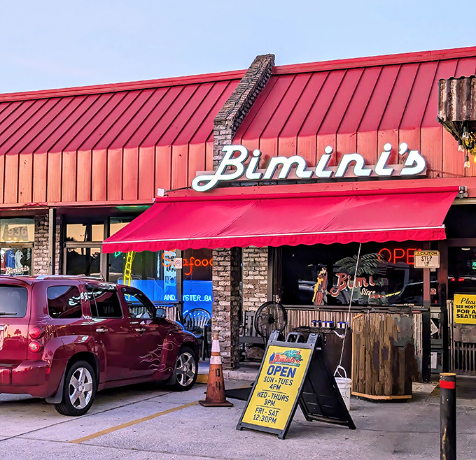The iconic red roof and awning of Bimini's stands as a beacon for seafood lovers. No fancy frills needed when the food speaks this loudly.