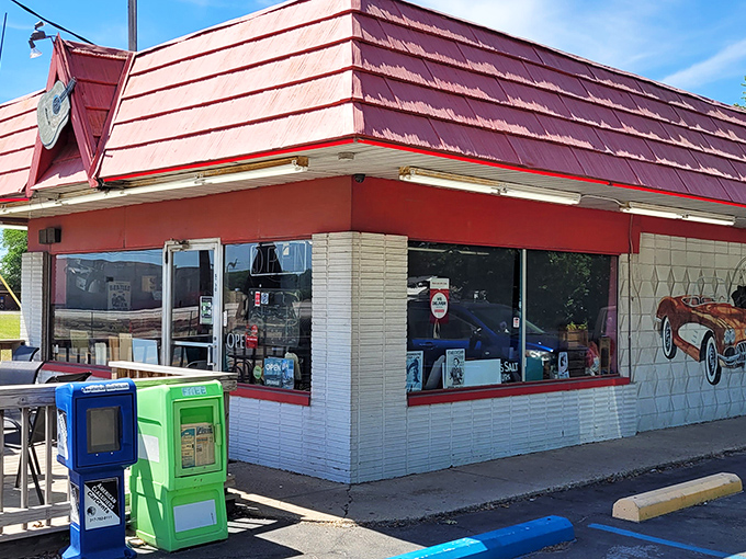 That iconic red roof beckons like a lighthouse for hungry travelers. Rock-Cola's exterior promises a journey back to simpler, more delicious times.