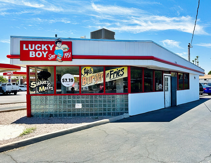 The iconic red and white Lucky Boy sign stands like a beacon of burger hope against the Arizona sky. Simplicity never looked so inviting.