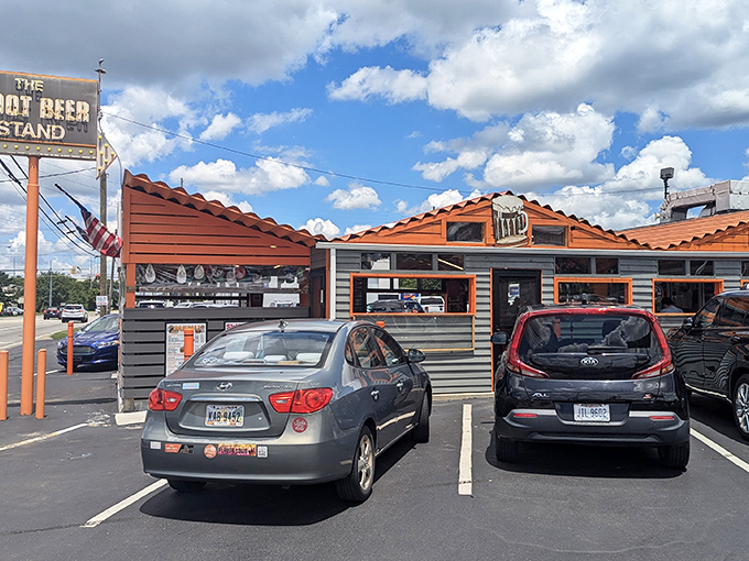 The iconic orange-trimmed exterior stands like a time capsule on Reading Road, its vintage sign promising simple pleasures that never go out of style. 